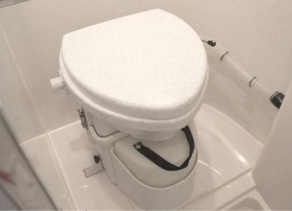 What is the P-trap of a toilet and where is it located?